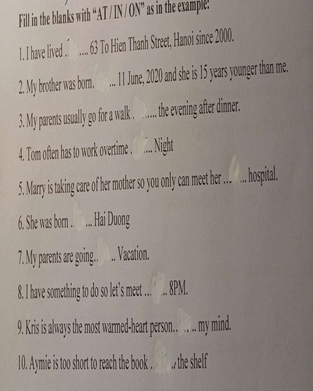Fill in the blanks with "AT/IN/ON" as in the example! 1. I have lived ...