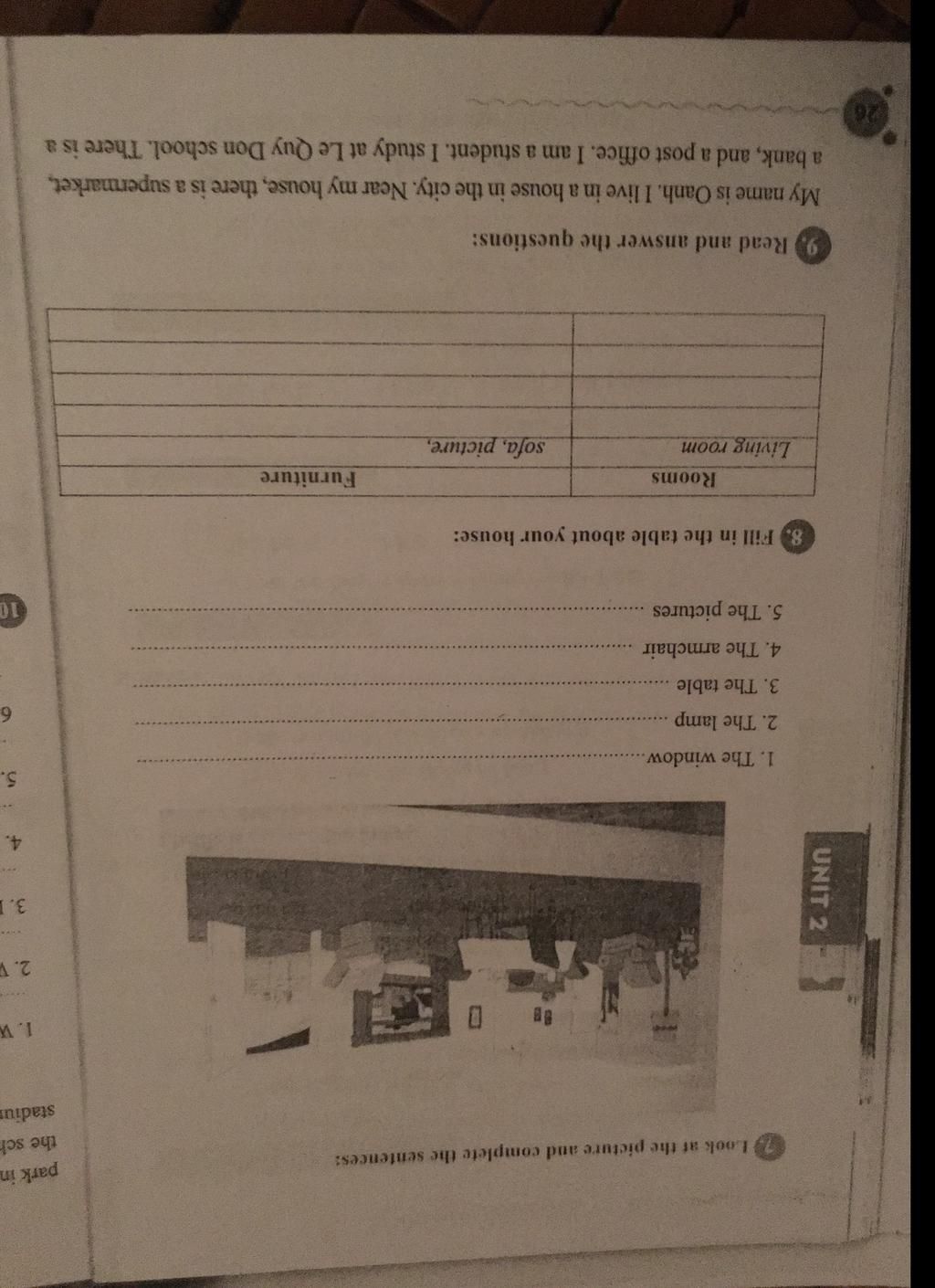 26 UNIT 2 Look at the picture and complete the sentences: 1. The window ...